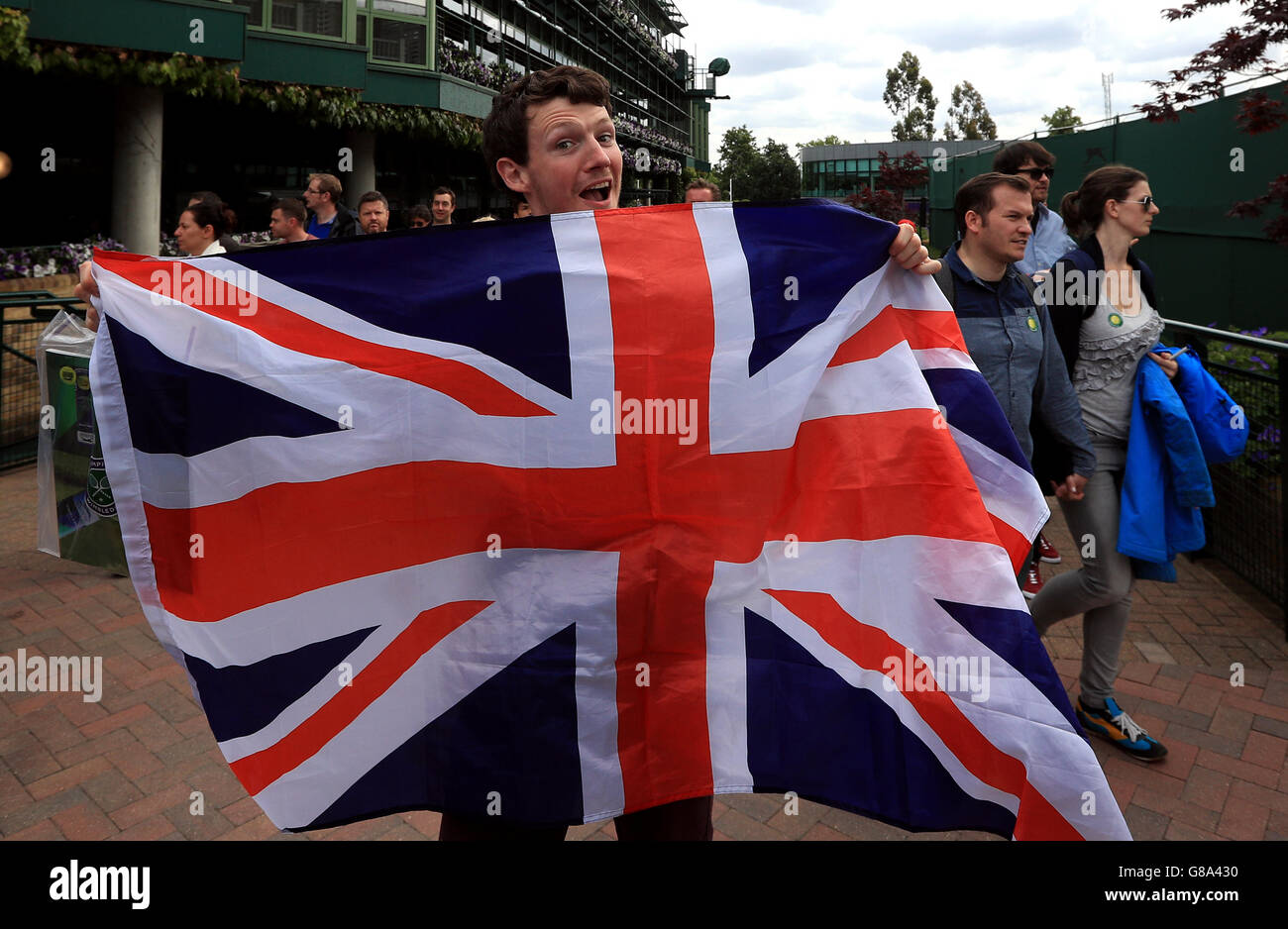 A fan with a Union Jack flag enters the grounds on day Two of the ...