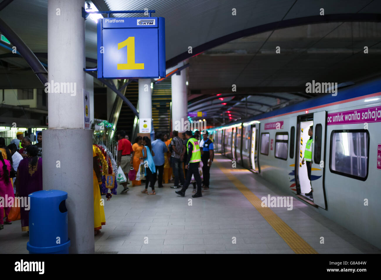Hindu devotees arriving at Batu Cave train station during Thaipusam ...