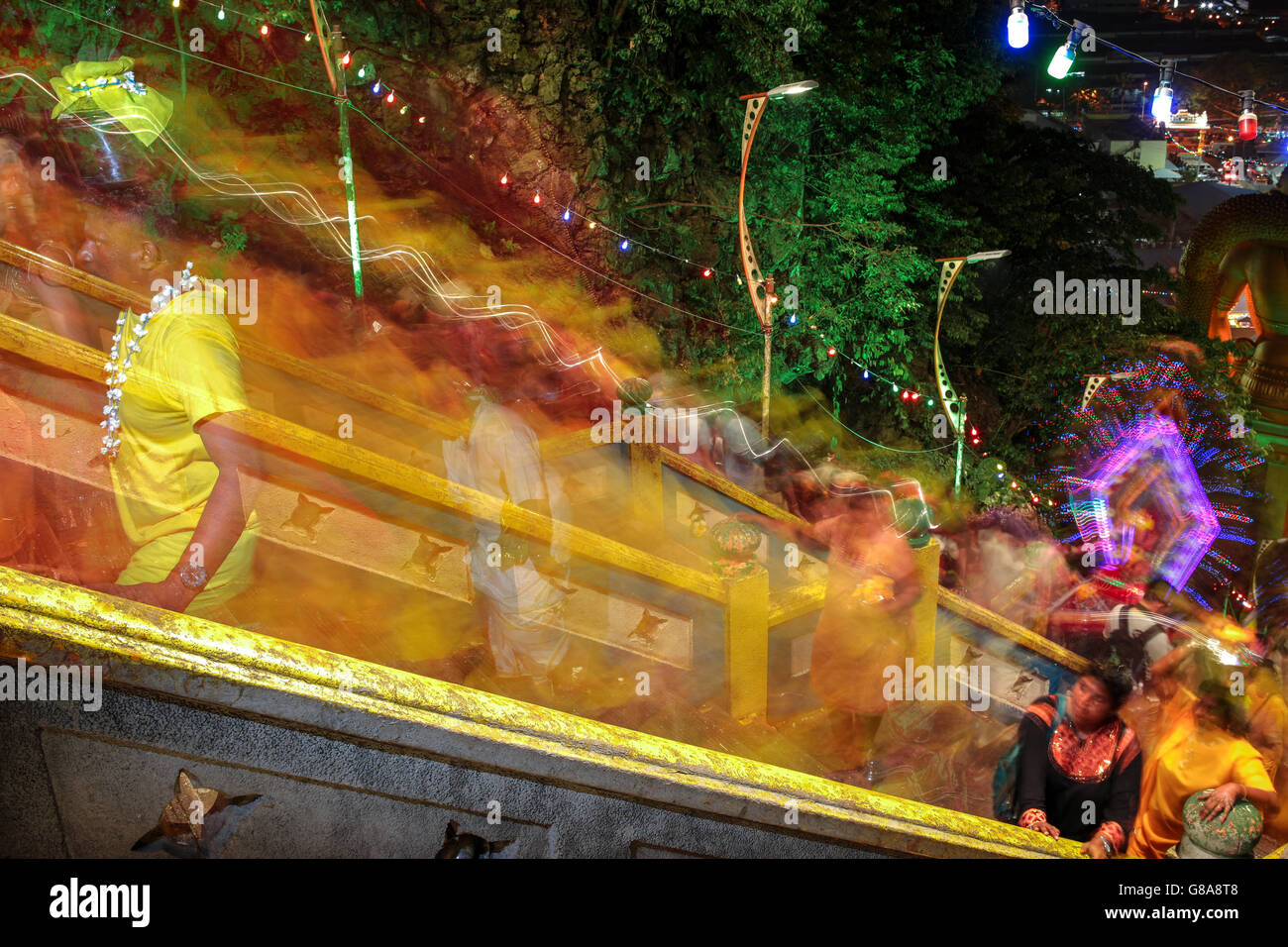 Long exposure scene of devotee crowd climbing the stair up Batu Cave ...