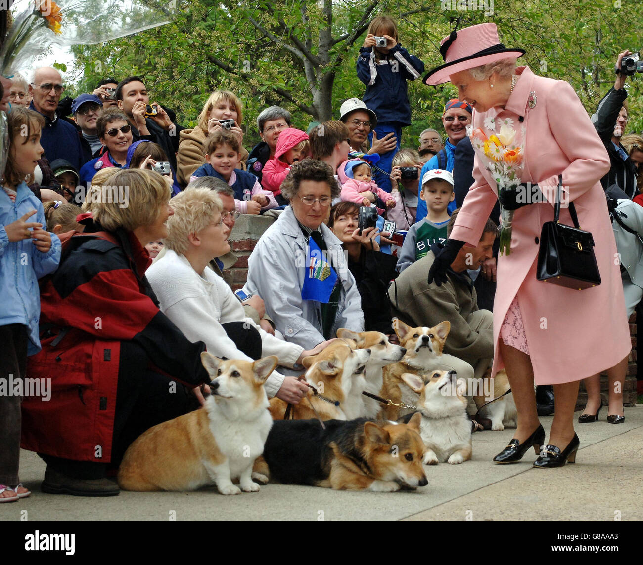 Britain's Queen Elizabeth II is greeted by local corgi enthusiasts as ...