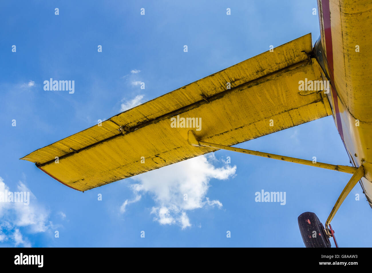 Vintage airplane seen from below, with blue sky in the background Stock ...