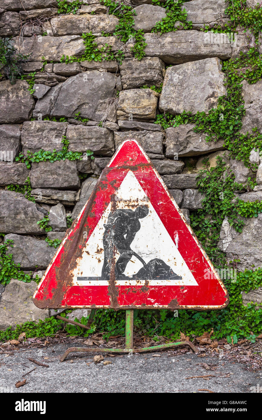 Old work in progress road sign with brick wall on background Stock ...