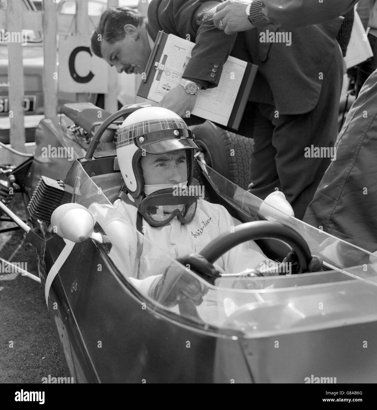 Proud Scot Jackie Stewart, wearing a tartan band on his helmet, in his ...