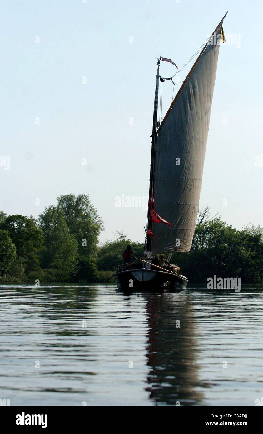 Hathor, a 56ft Norfolk Wherry heads down the broads at Bramerton. The ...