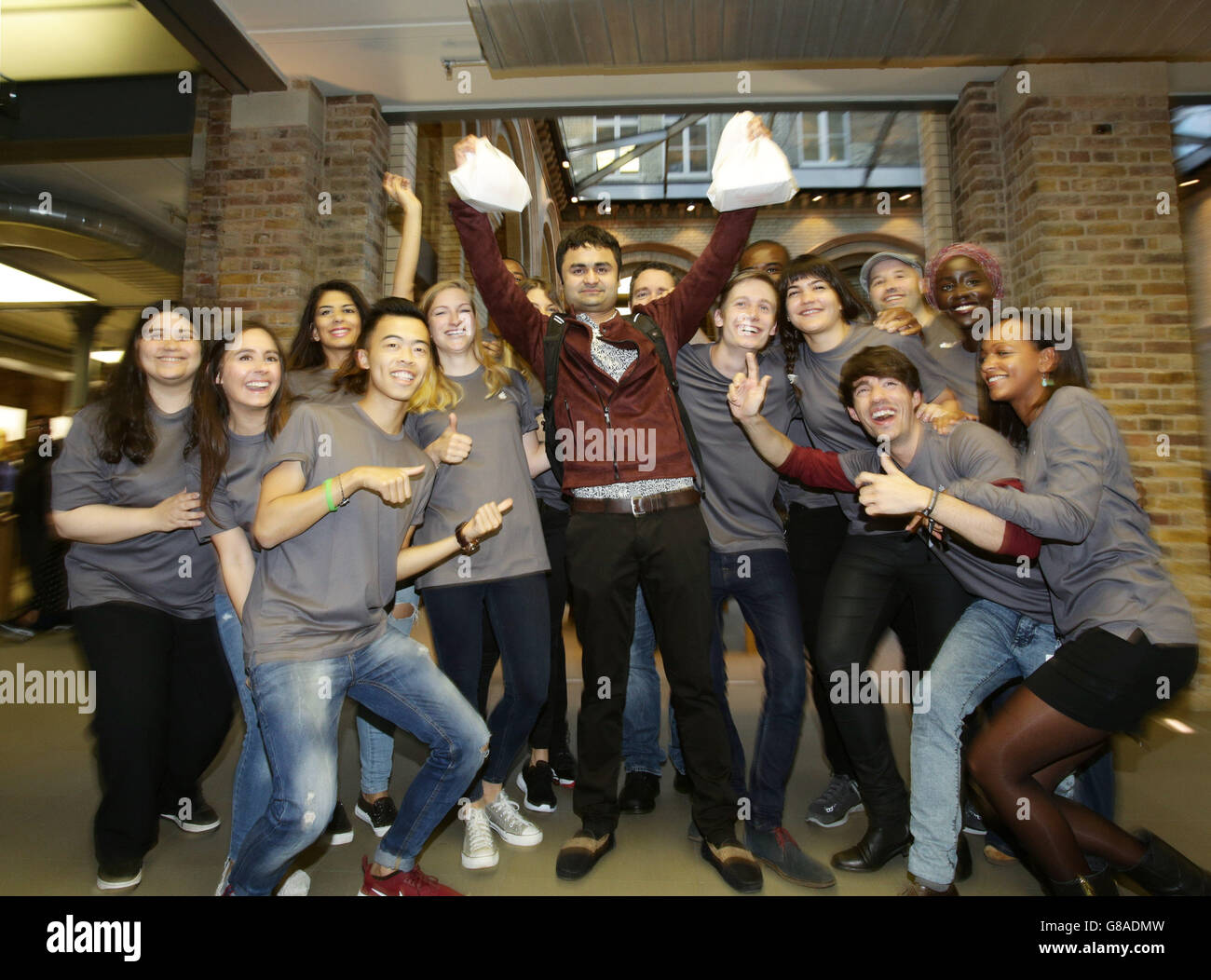 Sam Shaikh, 29, from Stratford, celebrates with staff after he was the ...