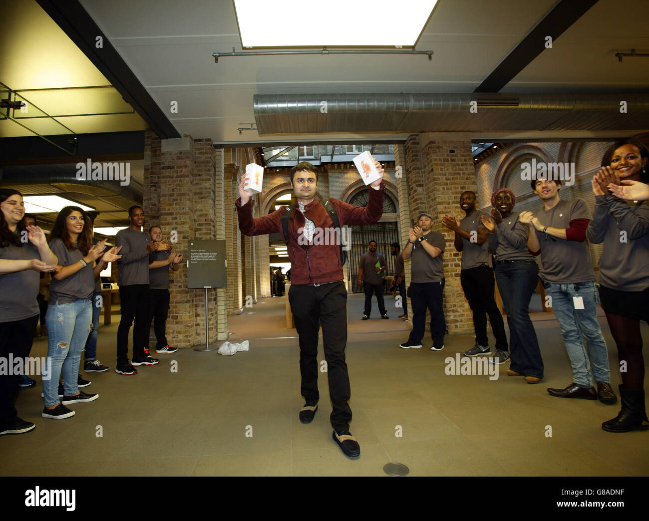Sam Shaikh, 29, from Stratford, celebrates with staff after he was the ...