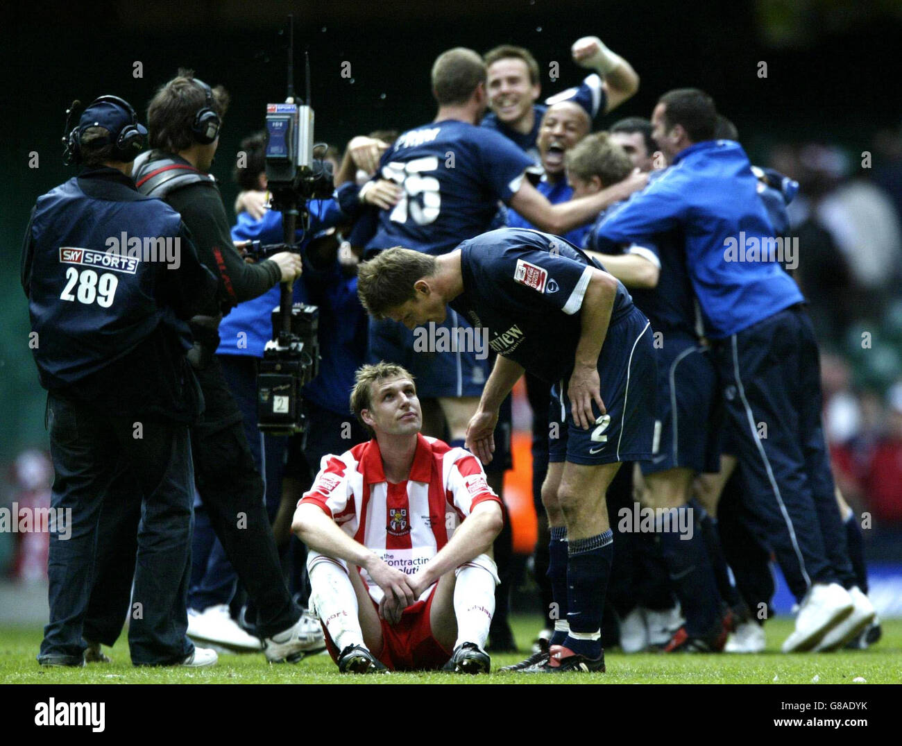 Southend United players (background) celebrates while goalscorer Duncan ...