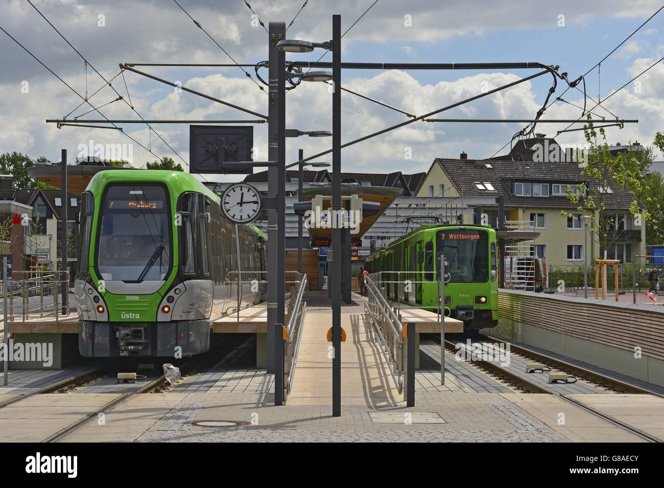 Two green light rail vehicles from Üstra at the platform at the last ...