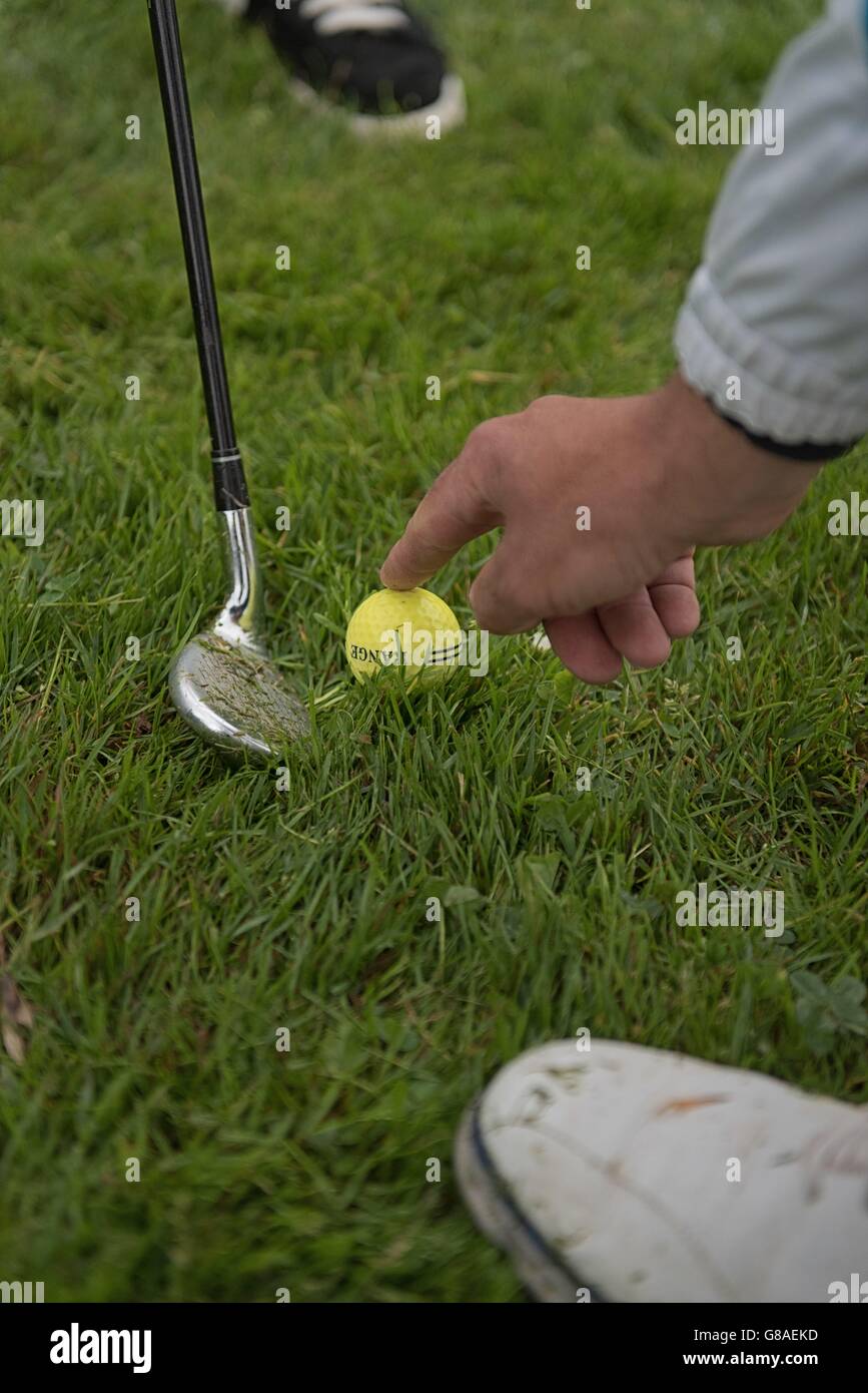 teacher explains how to tee off | usage worldwide Stock Photo - Alamy