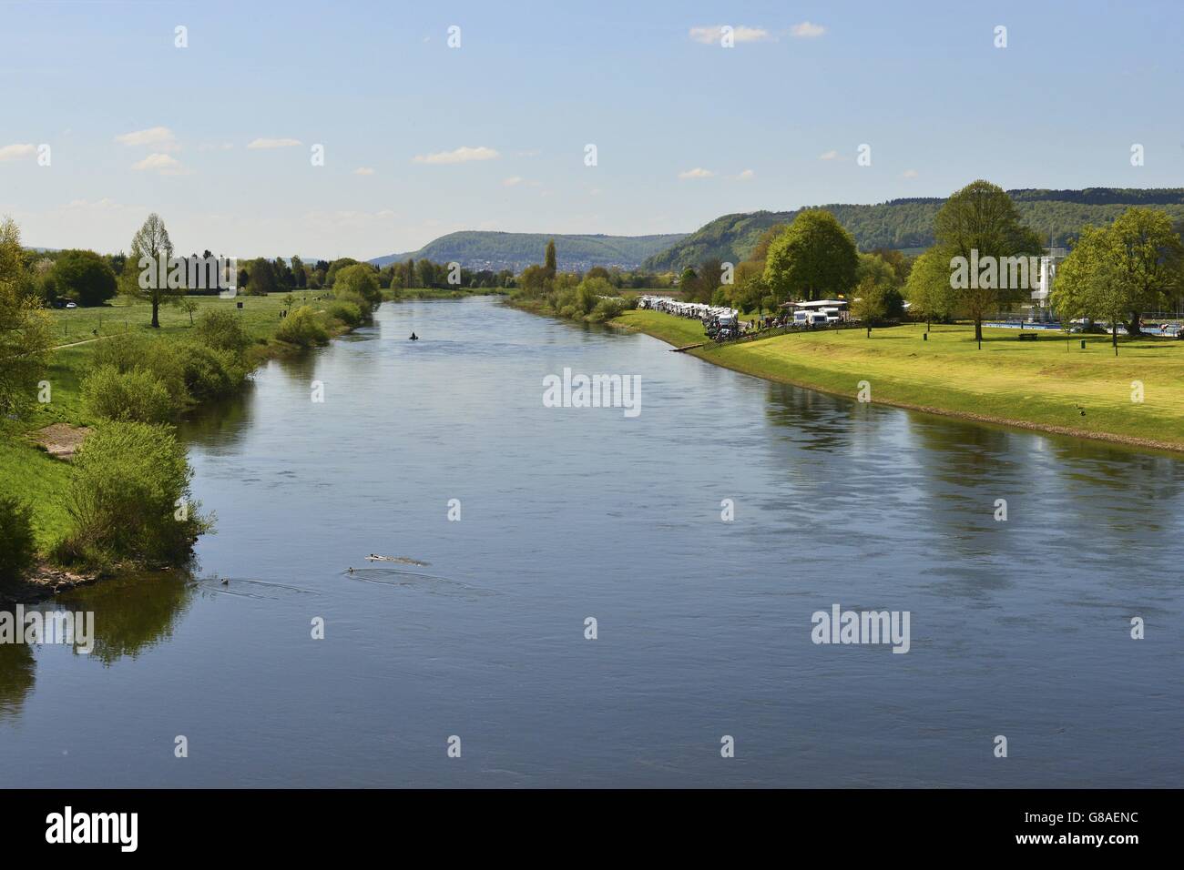 The Weser by Holzminden with a view to a campsite at the riverbank with ...