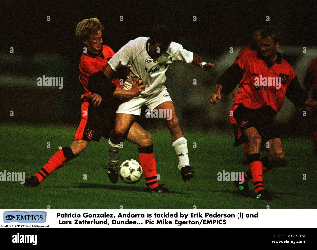 Patricio Gonzalez, Andorra is tackled by Erik Pederson (l) and Lars ...