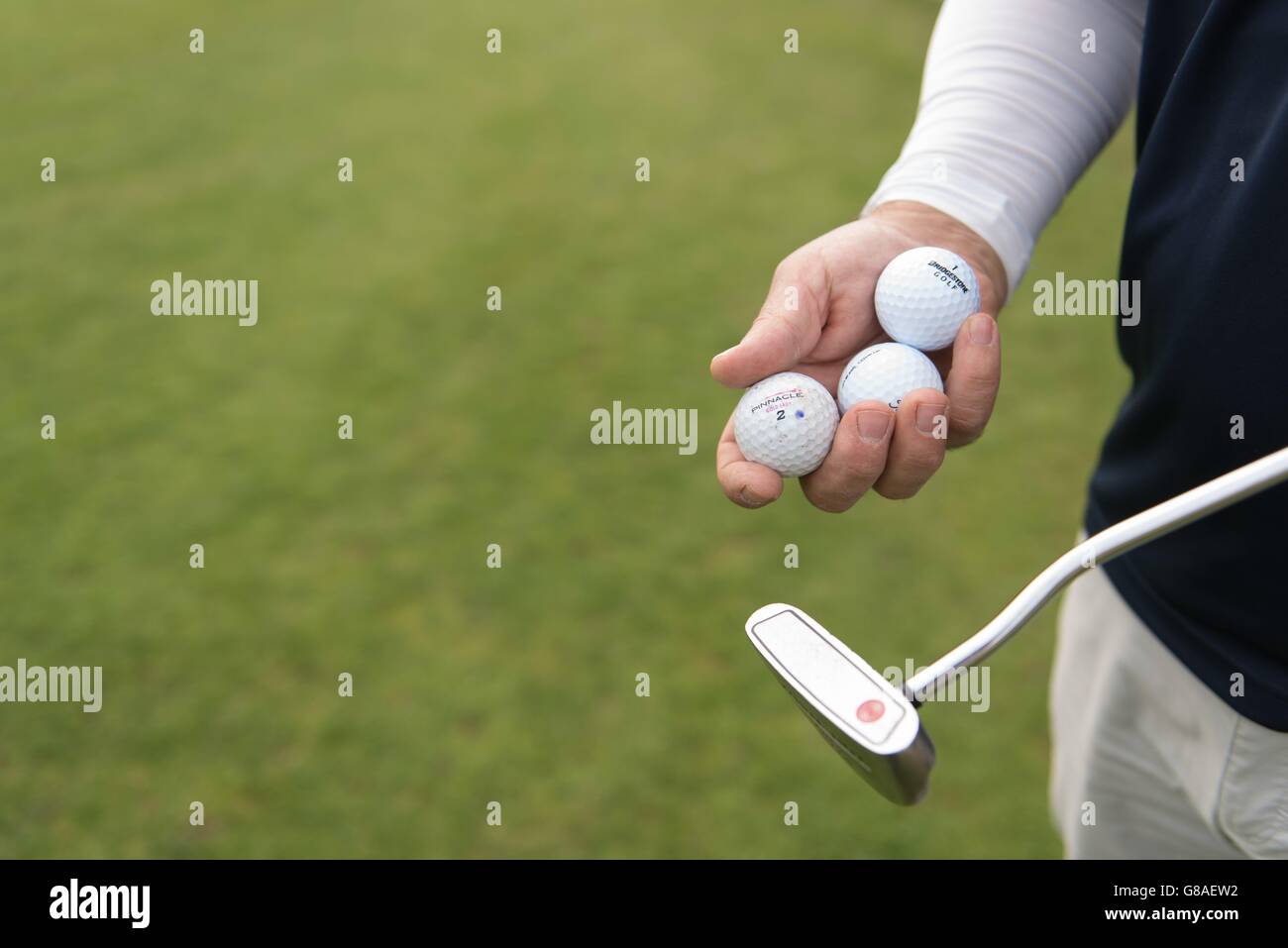 Putter in hand hi-res stock photography and images - Alamy