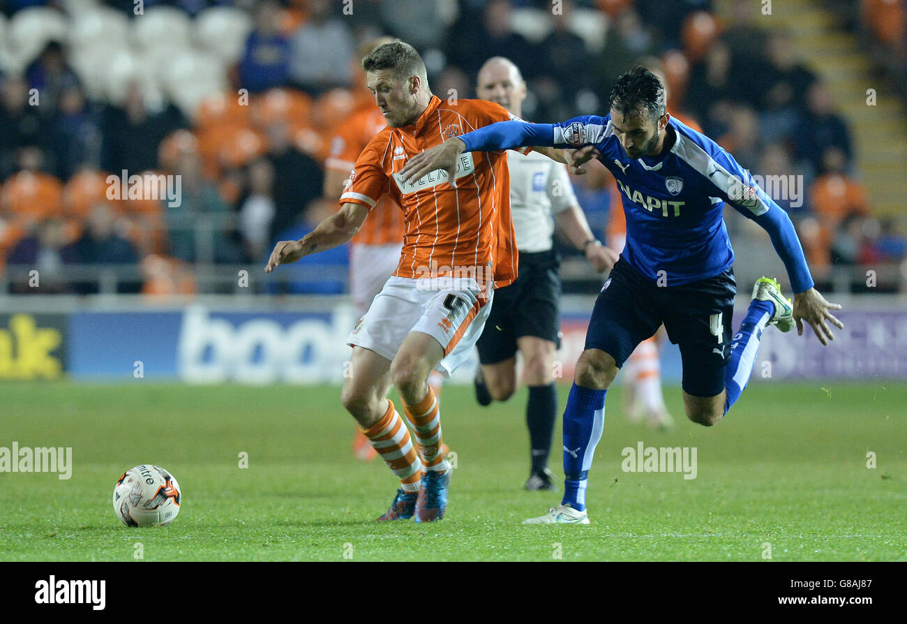 Blackpool's Jim McAlister battles for the ball with Chesterfield's Sam ...