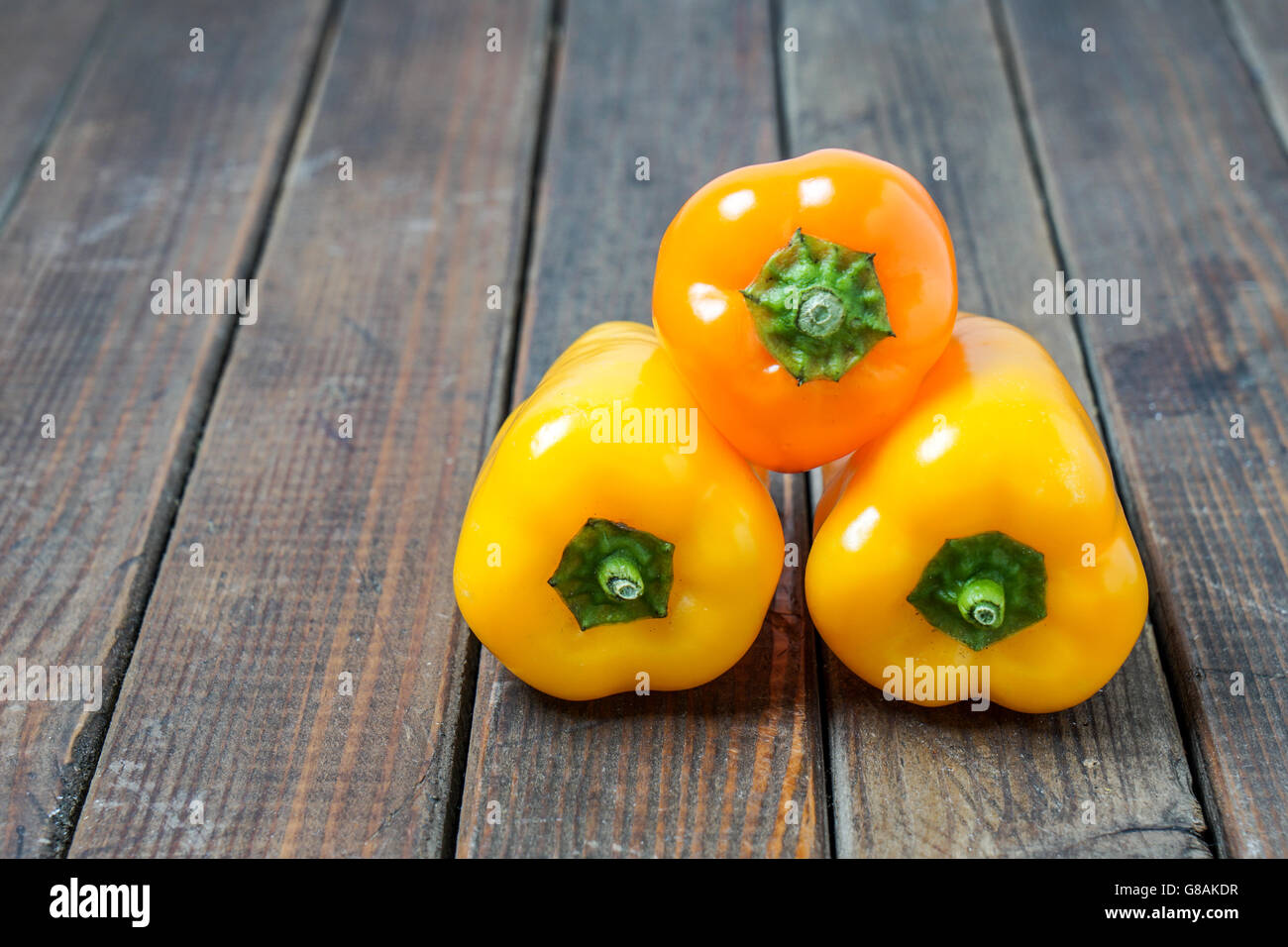 Small bell peppers in red and orange Stock Photo - Alamy