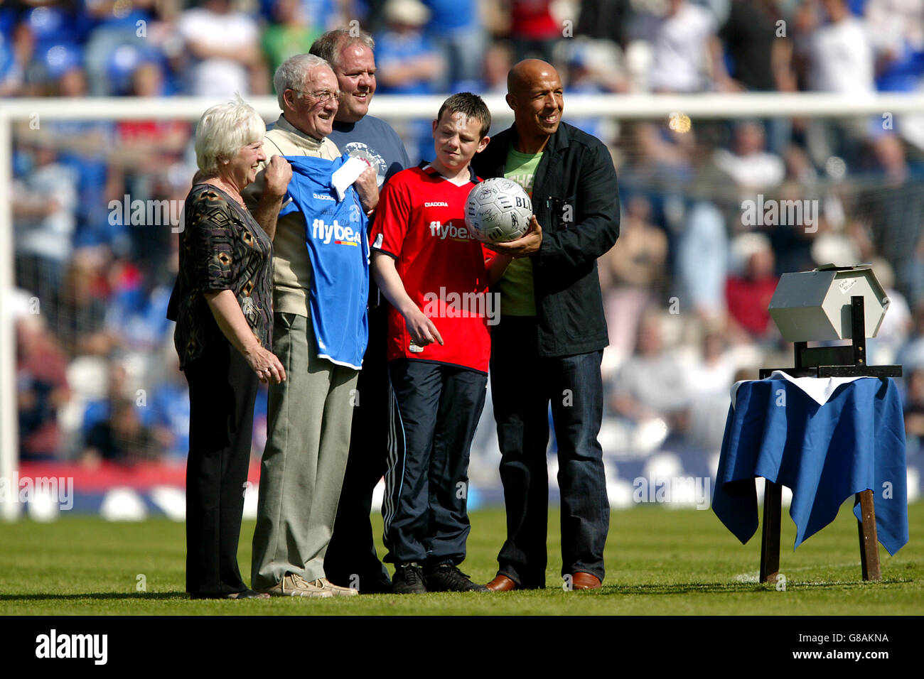 Birmingham City's former player Martin O'Connor (r) presents awards at ...