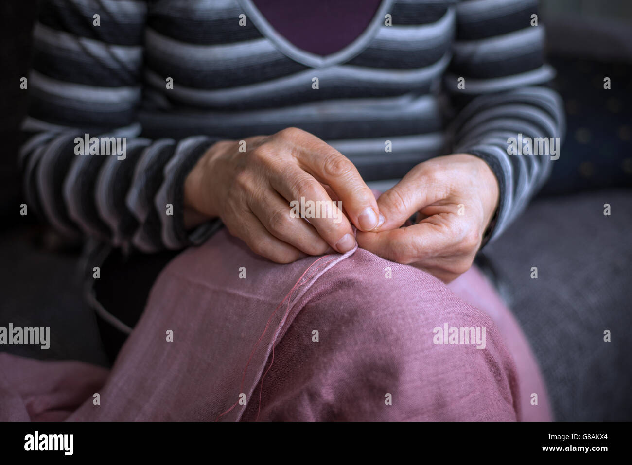 Close-up of woman's hands hand sewing Stock Photo - Alamy