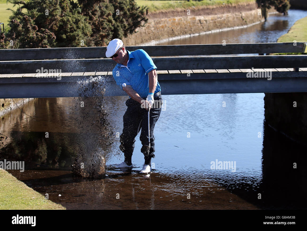 Scotland's Chris Doak plays a shot out of the Swilken Burn during day ...