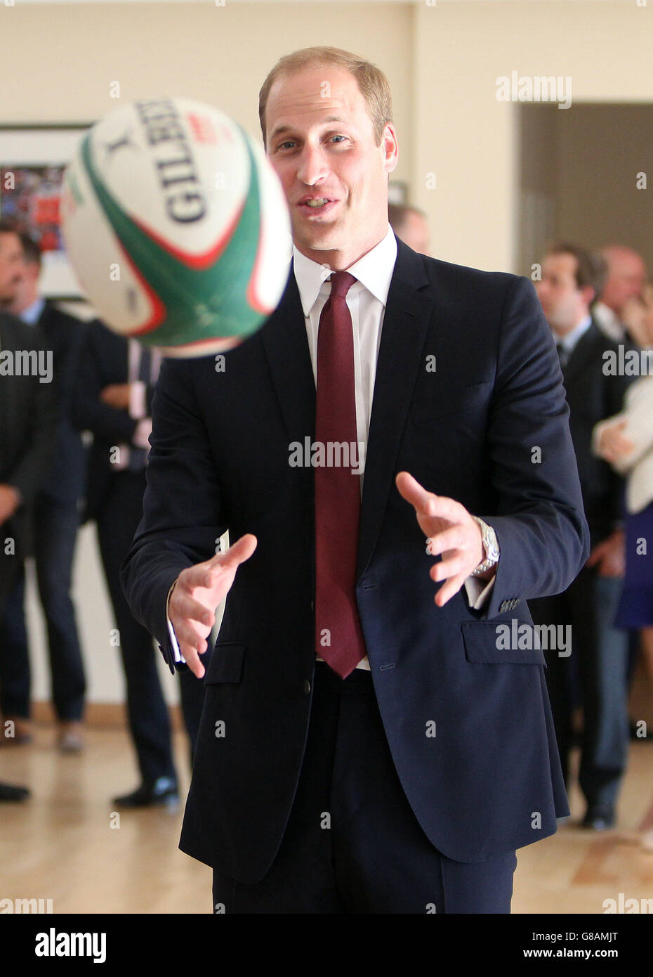 The Duke of Cambridge throws a rugby ball during a visit to the ...