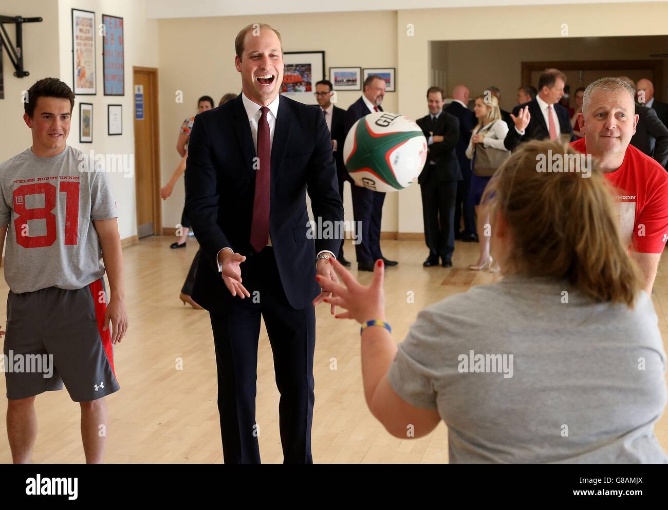 The Duke of Cambridge throws a rugby ball during a visit to the ...