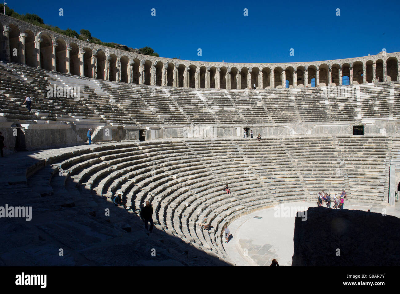 Panorama of semicircular stone seats at Aspendos Amphitheatre with ...