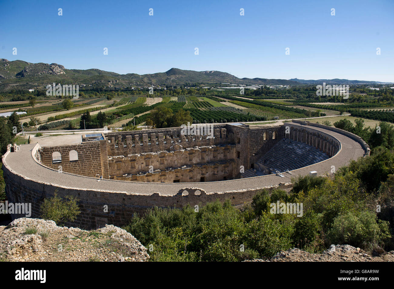 Panorama of semicircular stone seats at Aspendos Amphitheatre with ...