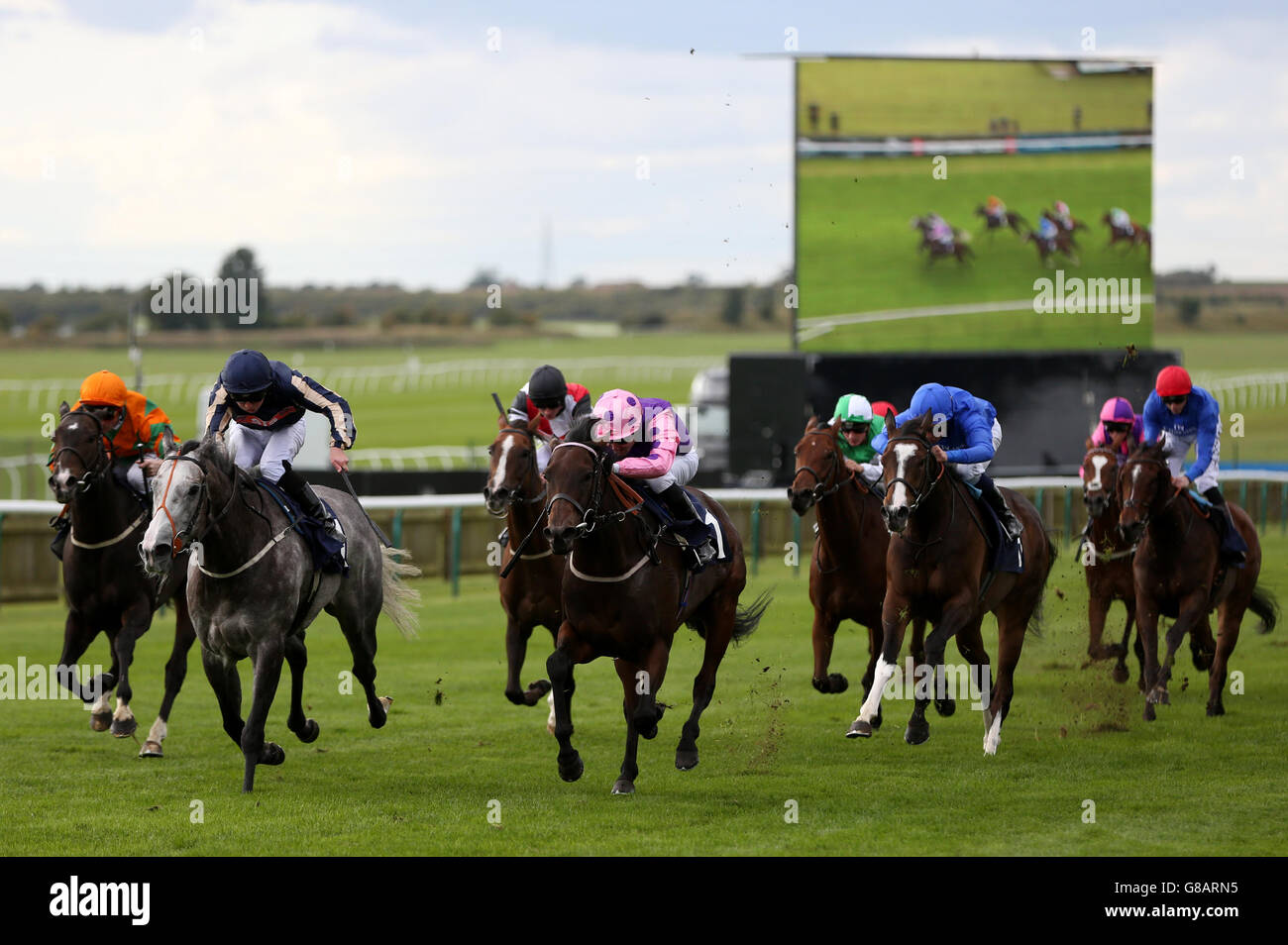 Golden Amber ridden by Pat Cosgrave (centre) wins a photo finish ahead ...