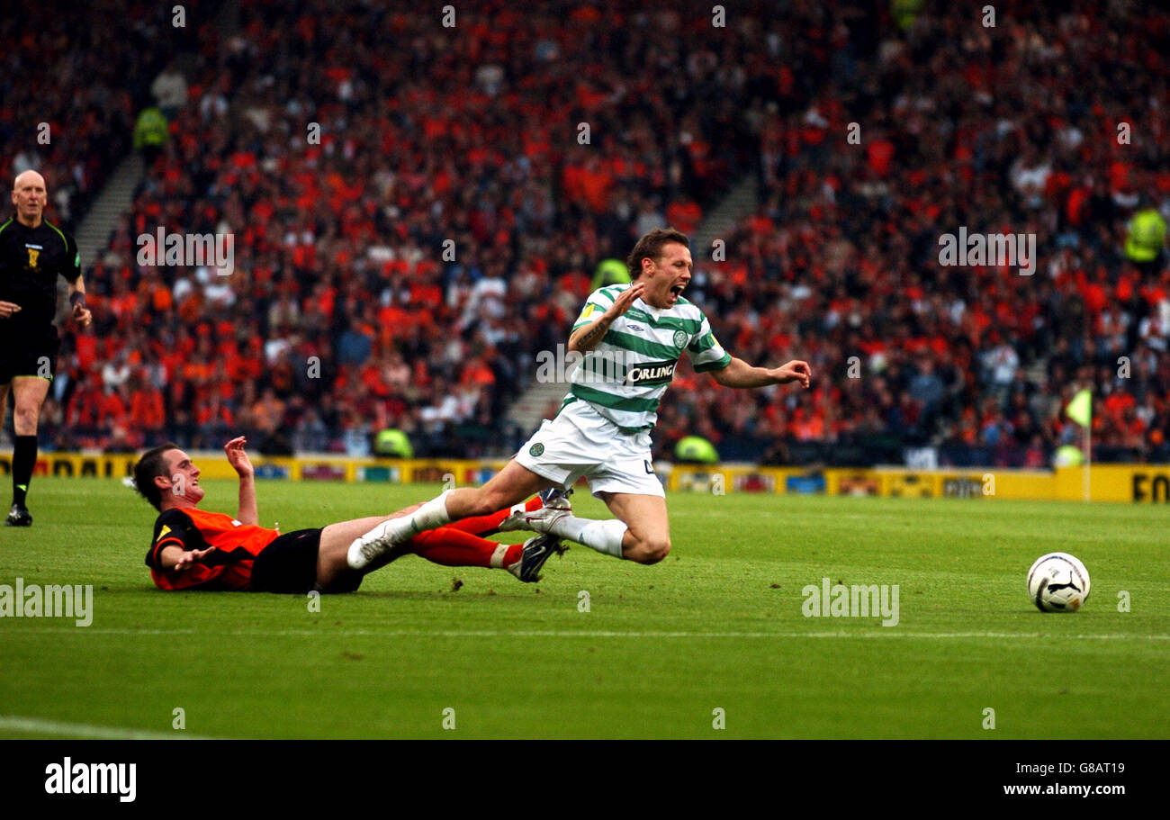 Celtics craig bellamy is fouled by dundee uniteds mark kerr hi-res ...