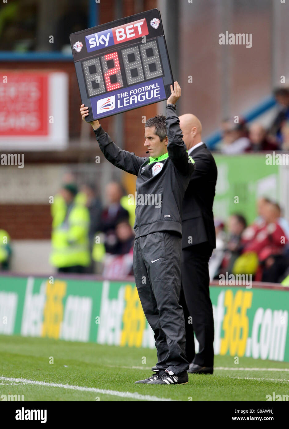 The fourth official holds up the electronic board showing the injury ...