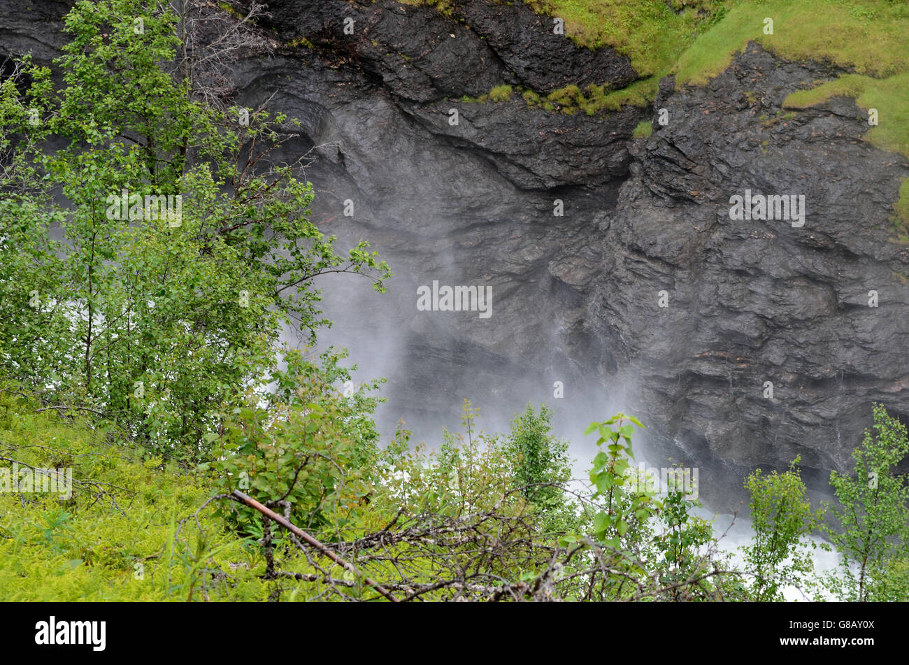 roaring waterfall with water vapor and mist Stock Photo - Alamy