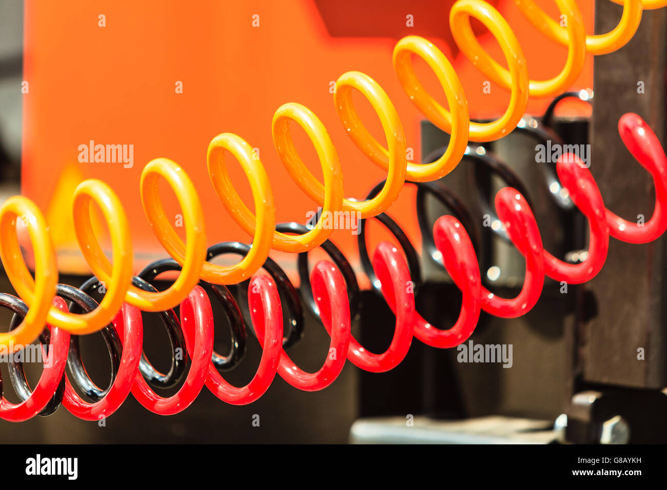 Closeup red yellow air connections hoses of machinery industrial detail ...