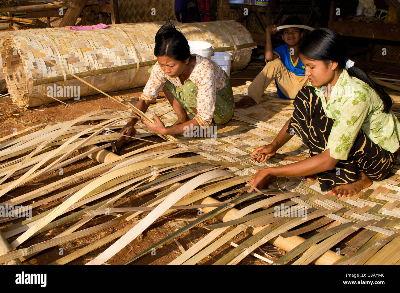 Asia - Myanmar - Taunggyi - Burma, women work on building bamboo mats ...
