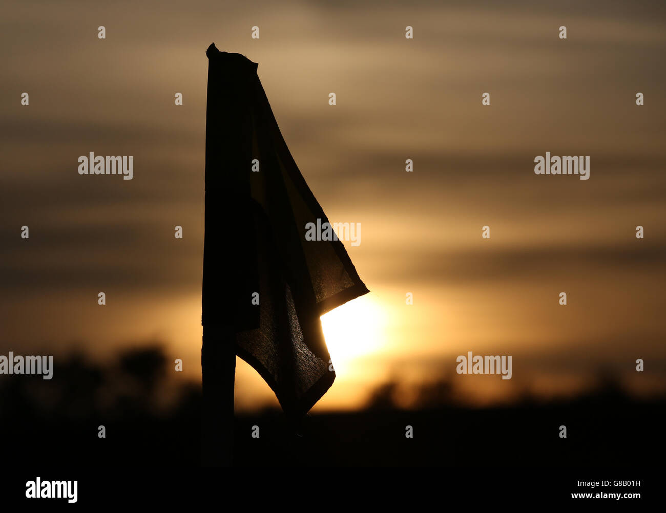 The sun sets behind flag at the pirelli stadium hi-res stock ...