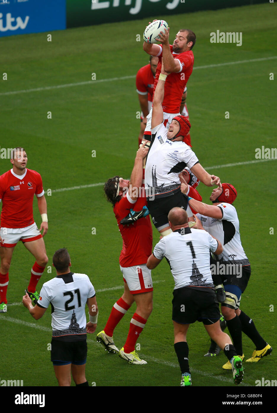 Canada's Brett Beukeboom wins a line out from Romania's Johannes van ...