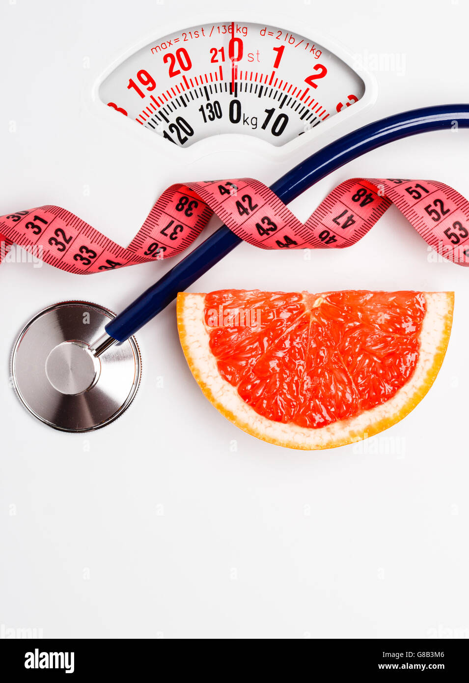 Diet healthy eating weight control concept. Grapefruit with measuring ...