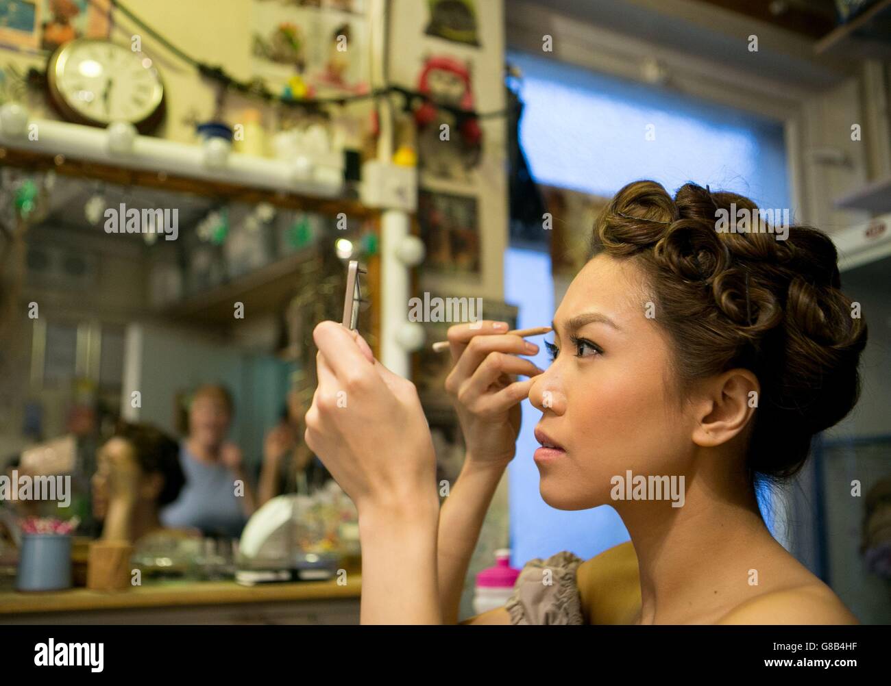 Actress and singer Rachelle Ann Go, gets ready backstage prior to the ...