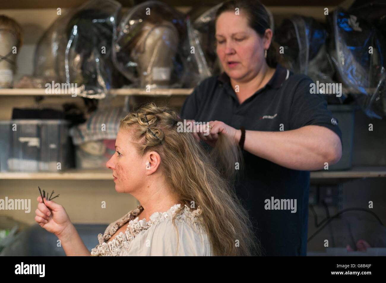 A make up artists helps Helen Walsh, get ready backstage prior to the ...