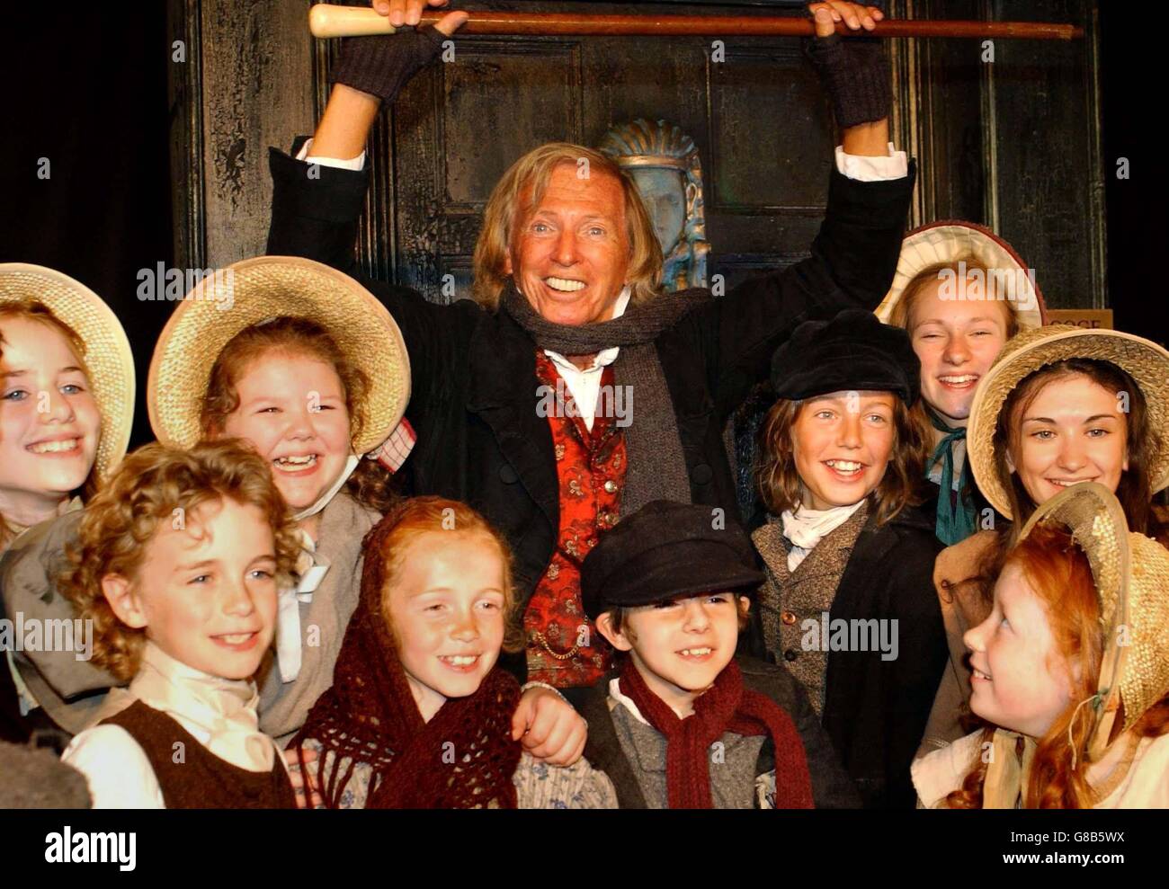 Pop legend Tommy Steele (centre), along with other members of the cast ...