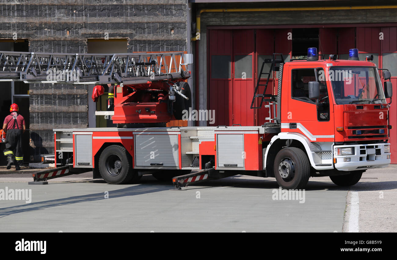 big red fire engine truck during a fire drill in the fire brigade ...