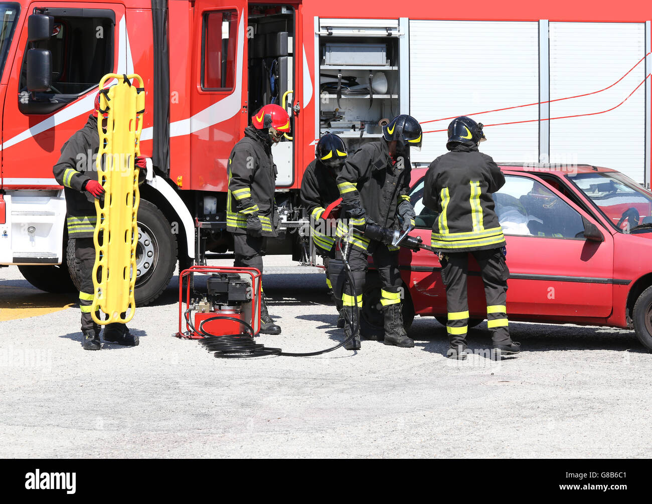 Firefighter opens car door with pneumatic shears after the accident ...