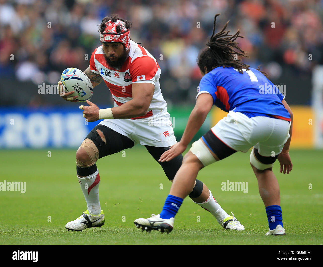 Japan's Koliniashi Holani (left) in action during to the World Cup ...