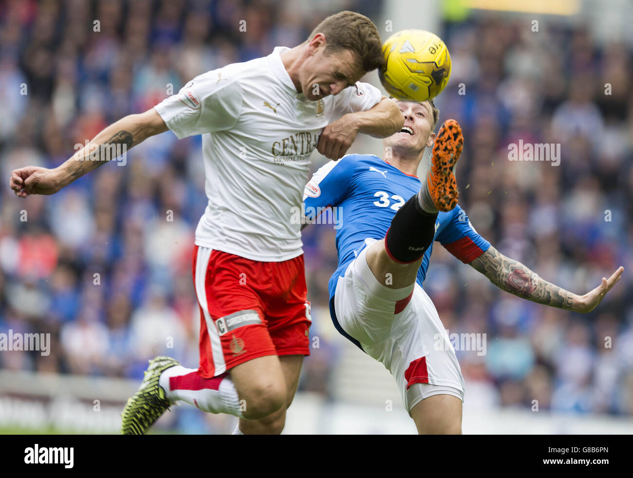 Falkirk's Aaron Muirhead (left) and Rangers Barrie Mckay battle for the ...