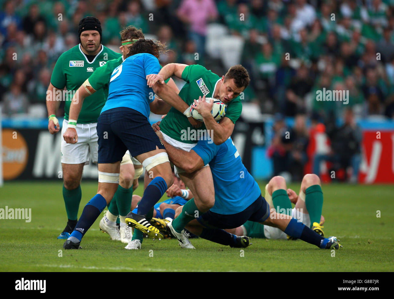 Ireland's Tommy Bowe gets tackled by Italy's Joshua Furno (left) and ...