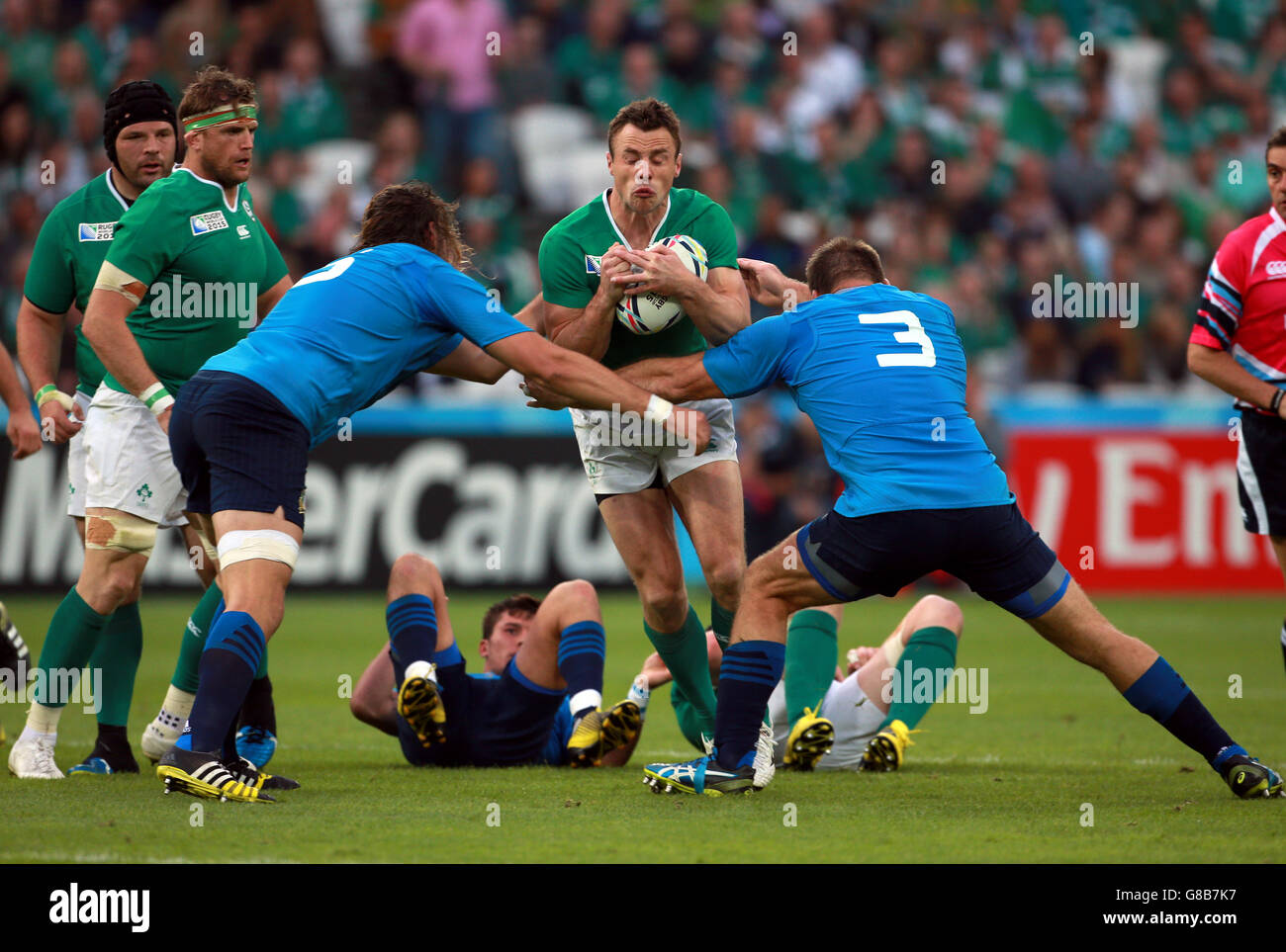Ireland's Tommy Bowe gets tackled by Italy's Joshua Furno (left) and ...