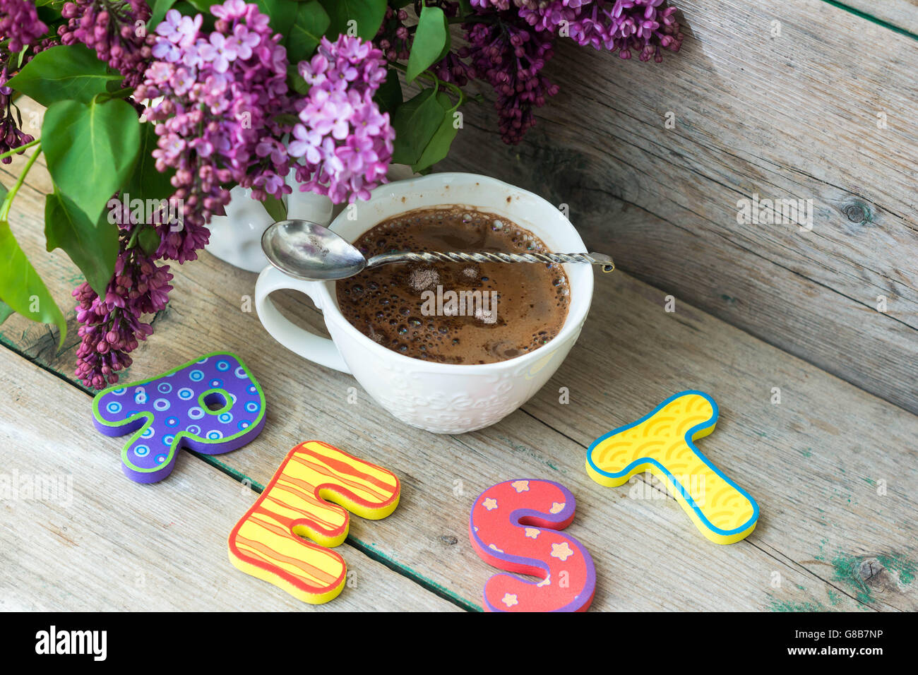 Lilac flowers in a pot and rest letters on the wooden table Stock Photo ...