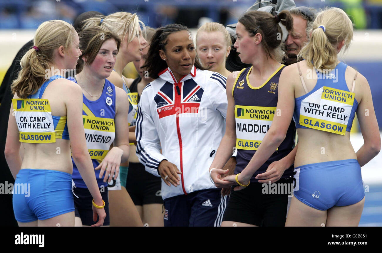 Great Britain's Kelly Holmes with young athletes who have just competed ...