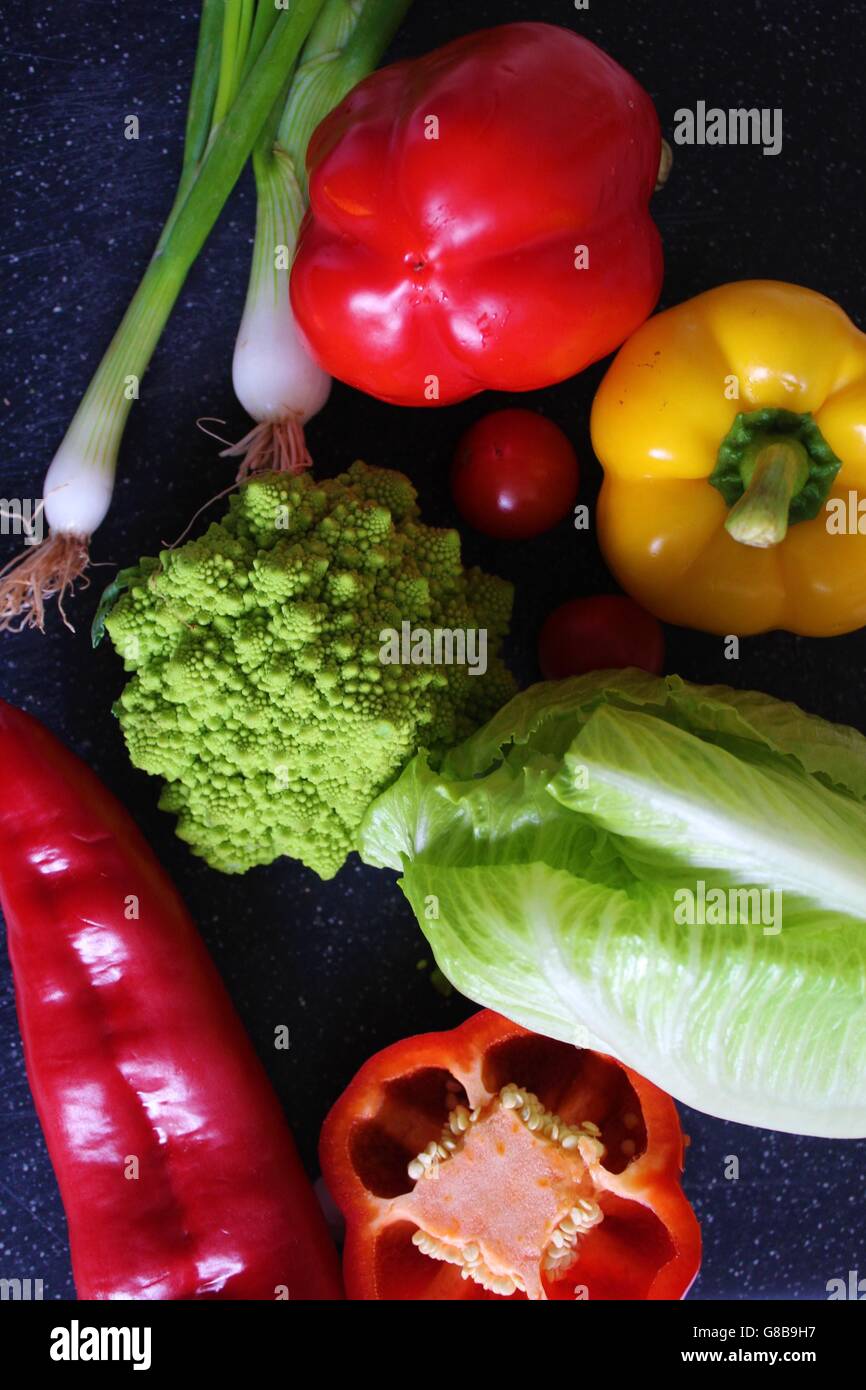 Vibrant, brightly colored, fresh vegetables, including peppers ...