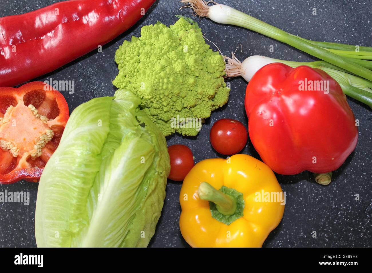Vibrant, brightly colored, fresh vegetables, including peppers ...