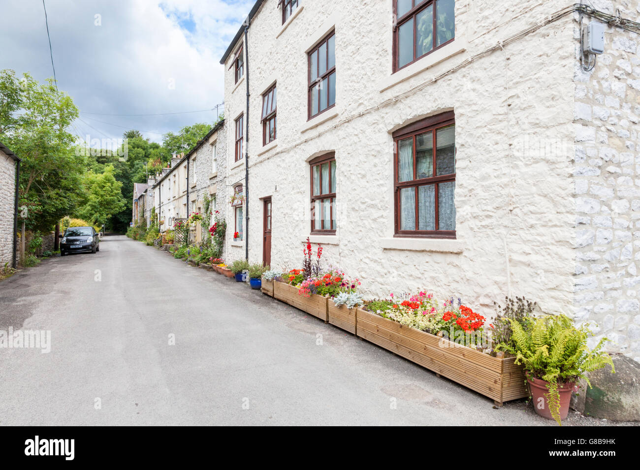 A row of cottages in the hamlet of Litton Mill, Derbyshire, England, UK ...