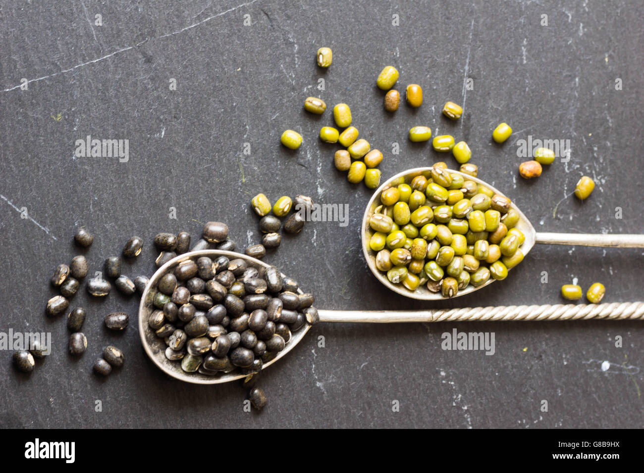 mixed bean on metal scoop on black table Stock Photo - Alamy