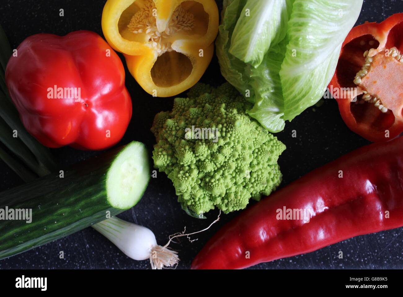 Vibrant, brightly colored, fresh vegetables, including peppers ...